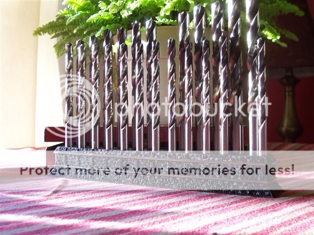 Cast metal drill bit stands